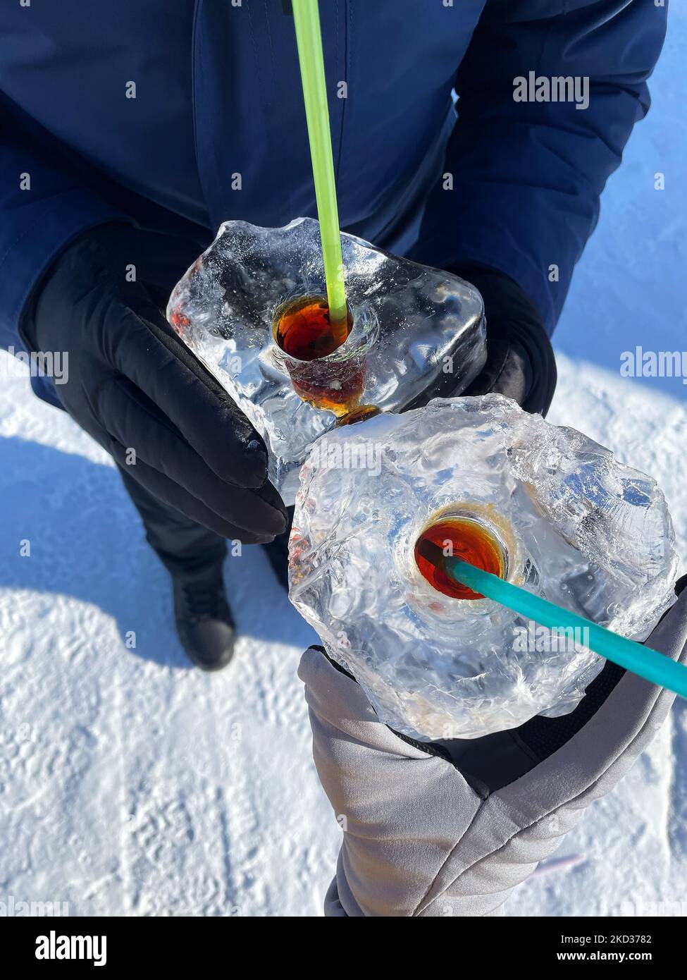 Baikal Ice Bar: man and woman drinking strong alcohol from ice cubes ...