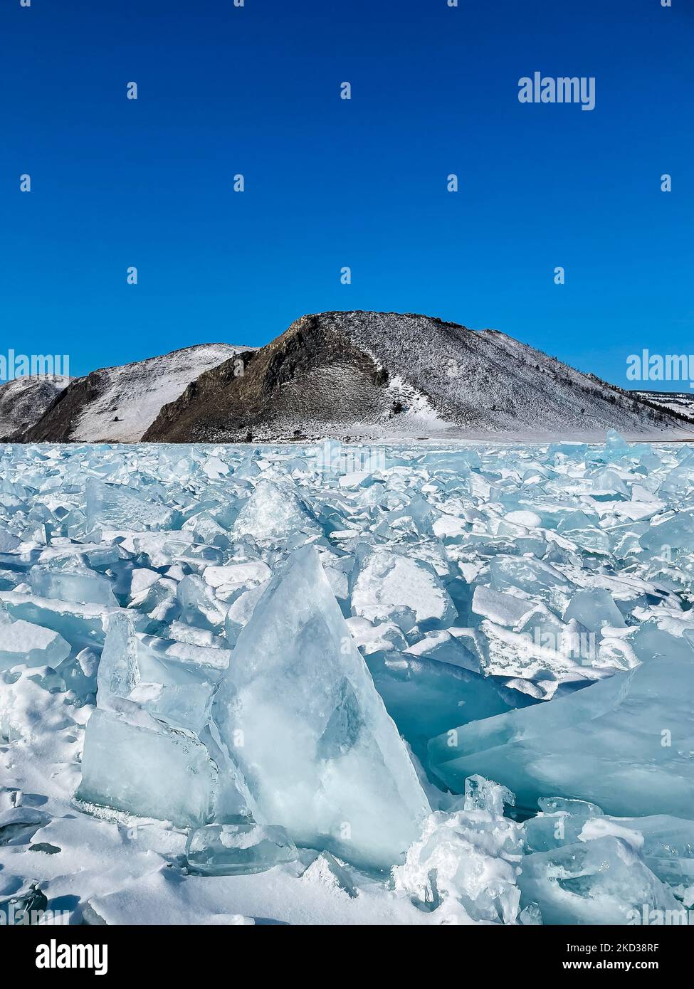 Texture of beautiful blue ice with cracks and air bubbles in the frozen ...