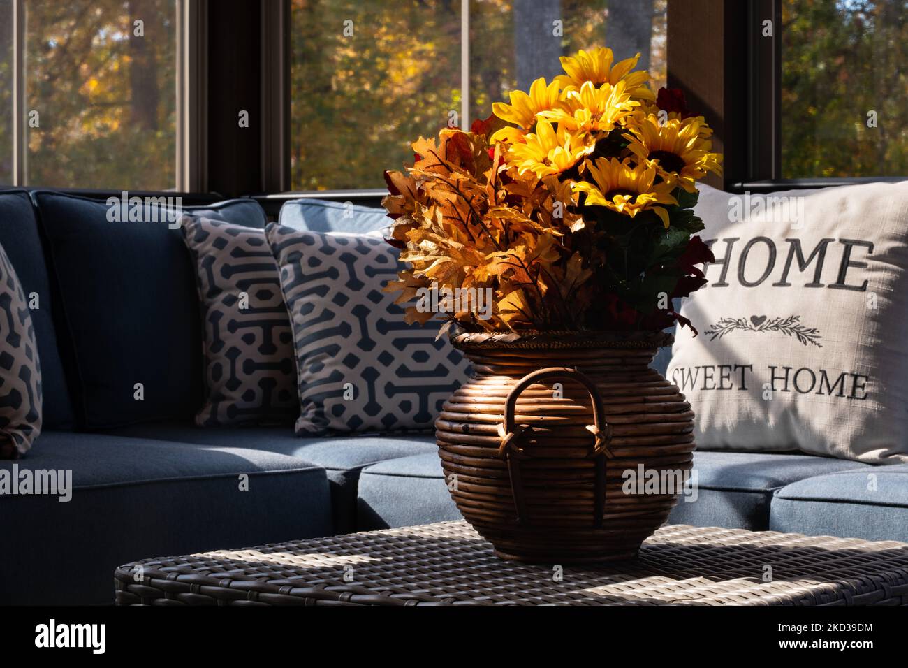 Cozy screened porch enclosure view in autumn. Flower bouquet in a vase ...
