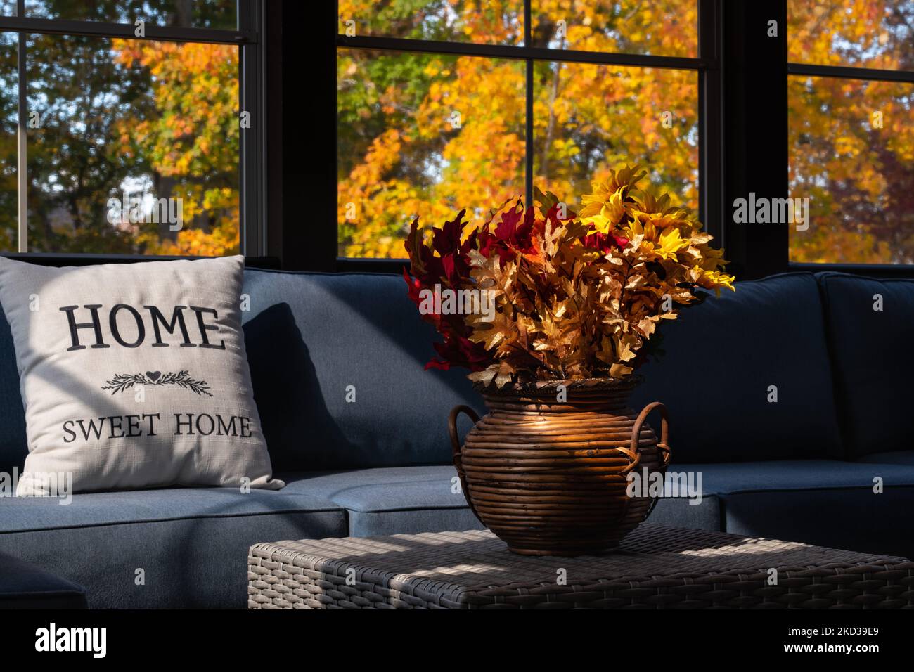 Cozy screened porch enclosure view in autumn. Flower bouquet in a vase ...