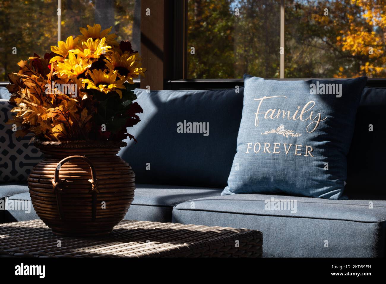 Cozy screened porch enclosure view in autumn. Flower bouquet in a vase ...