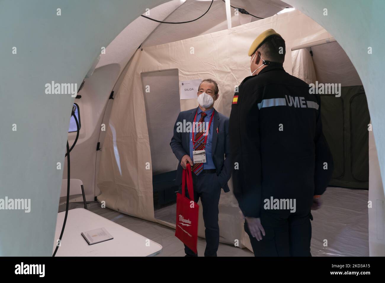 A visitor looks inside one of the tents used by the UME emergency unit ...