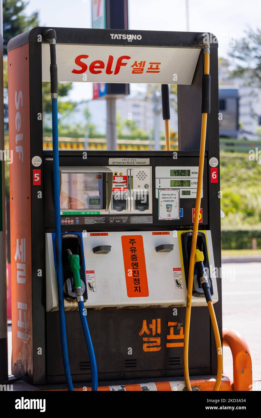 A vertical closeup of a self-service gas pump in Korea street view ...
