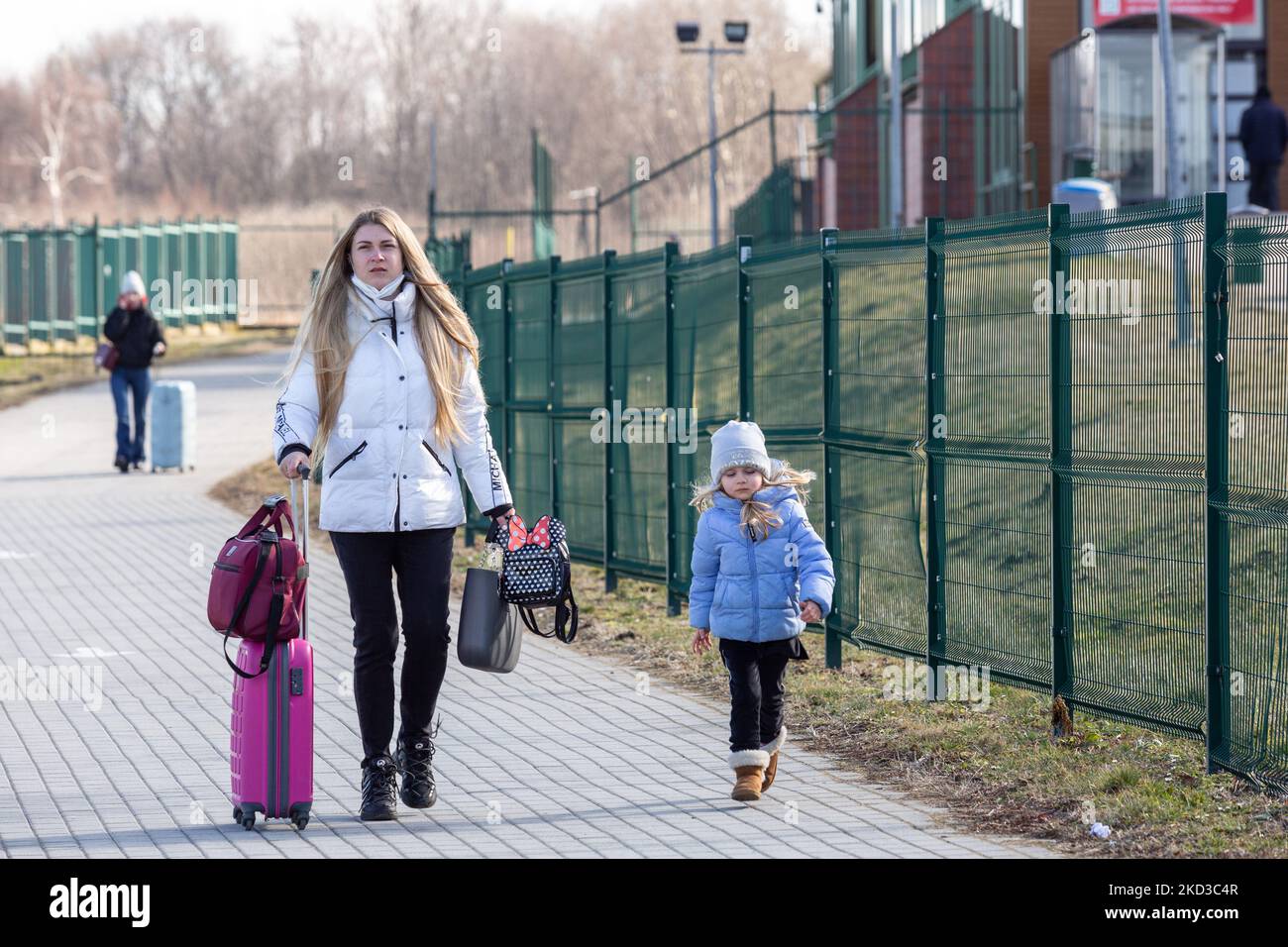 First migrants from Ukraine enter Poland after Russia bombarded ...