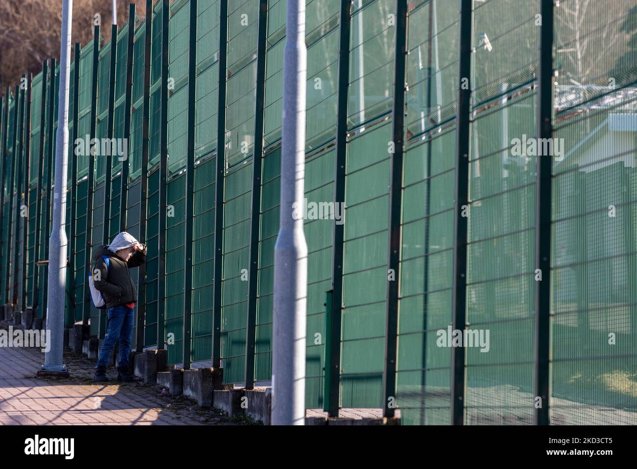 Ukrainian boy walks through border passage as first migrants from ...