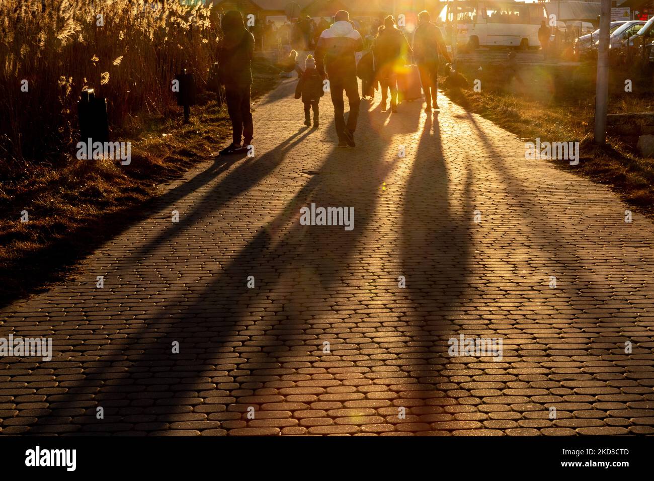 Ukrainian family walks through border passage as first migrants from ...