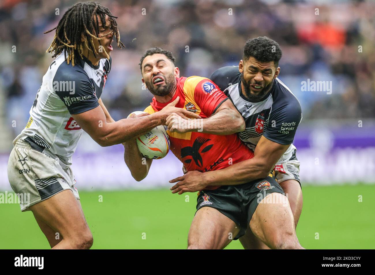 Alex Johnston of Papua New Guinea is tackled by Kallum Watkins of ...