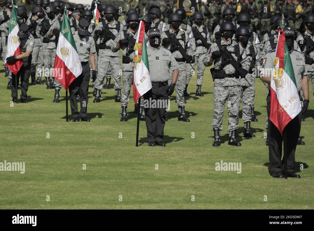 Members of the National Guard hold flags inside the installations of ...