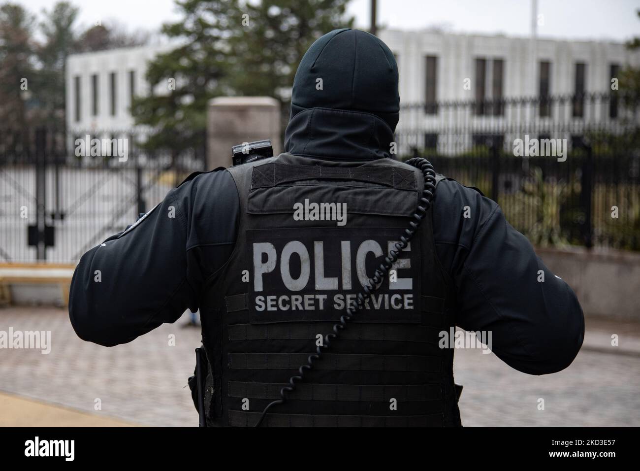 A U.S. Secret Service officer stands during a protest in front of the ...
