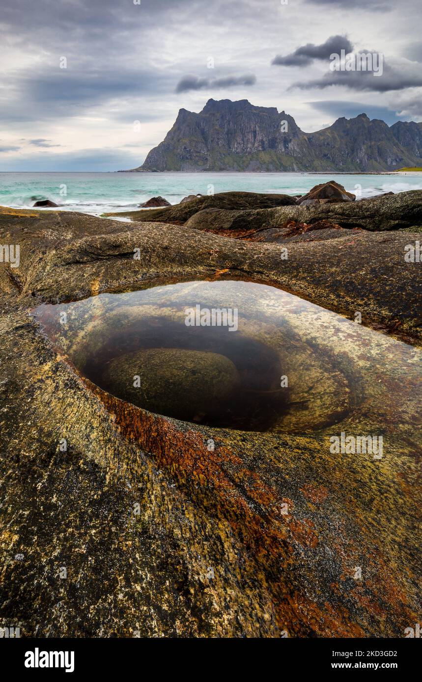 A beautiful shot of the dragon's eye in Norway with a lake and mountain ...