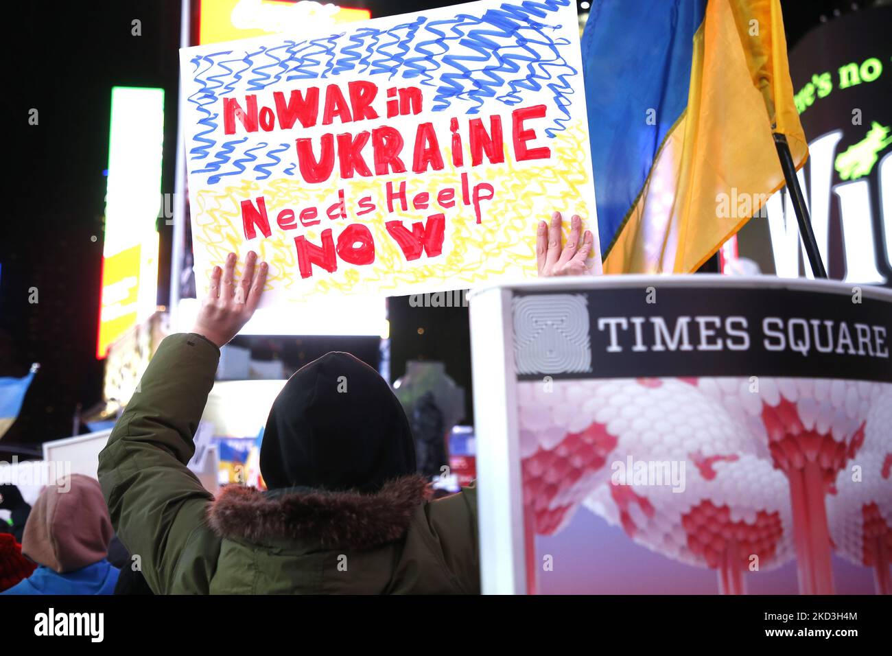Ukraine supporters rally in Times Square holding flags, signs and ...