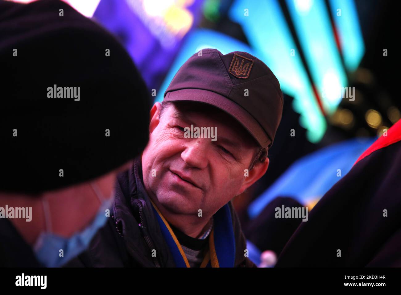 Ukraine supporters rally in Times Square holding flags, signs and ...