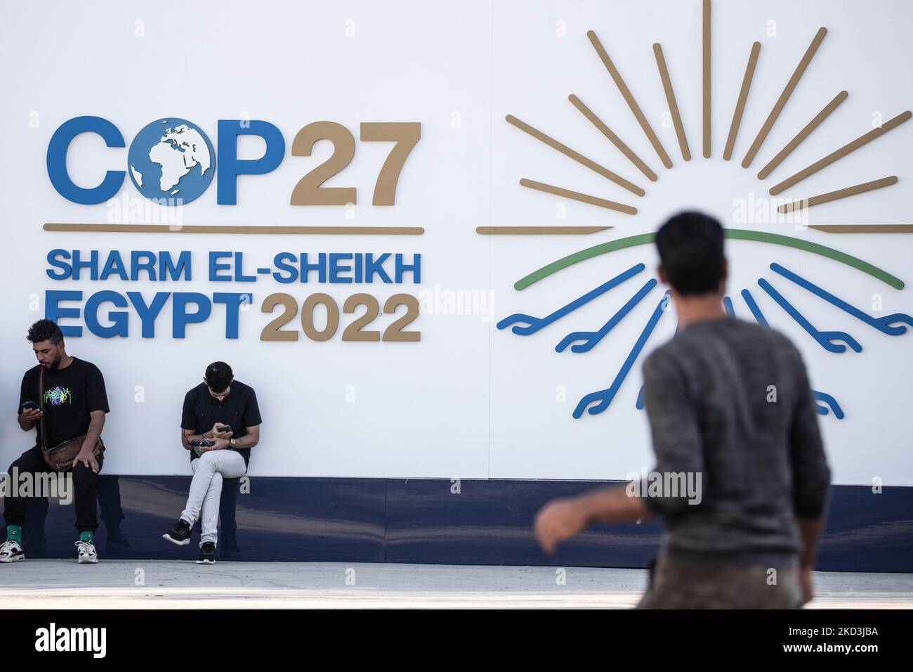 Sharm El Sheikh, Egypt. 05th Nov, 2022. Volunteers rest by the logo of ...