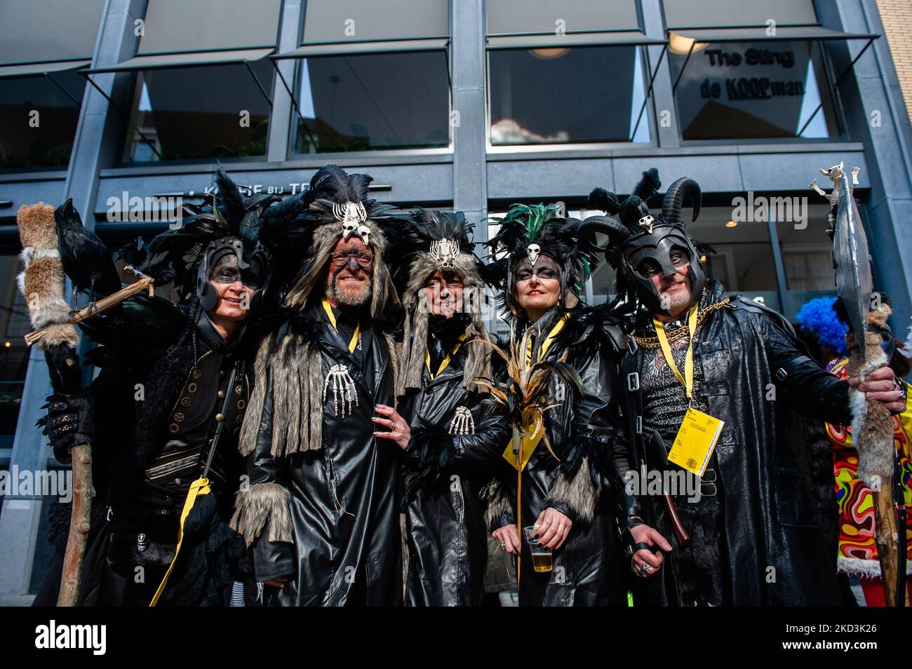 A group of people wearing costumes is posing, during the start of the ...