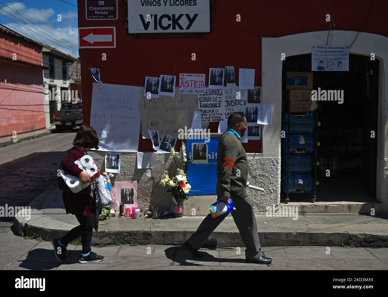 Locals pass by a memorial and place where Paula Ruiz de los Santos, a ...