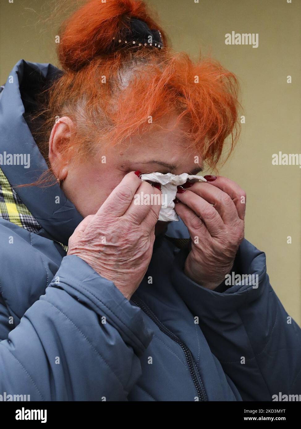 A woman is crying after arriving on a train from Ukraine to the railway ...