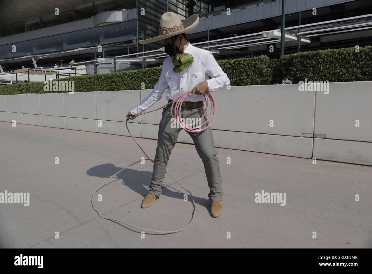 A charro performs floreo de reata at the Hipódromo de Las Américas ...