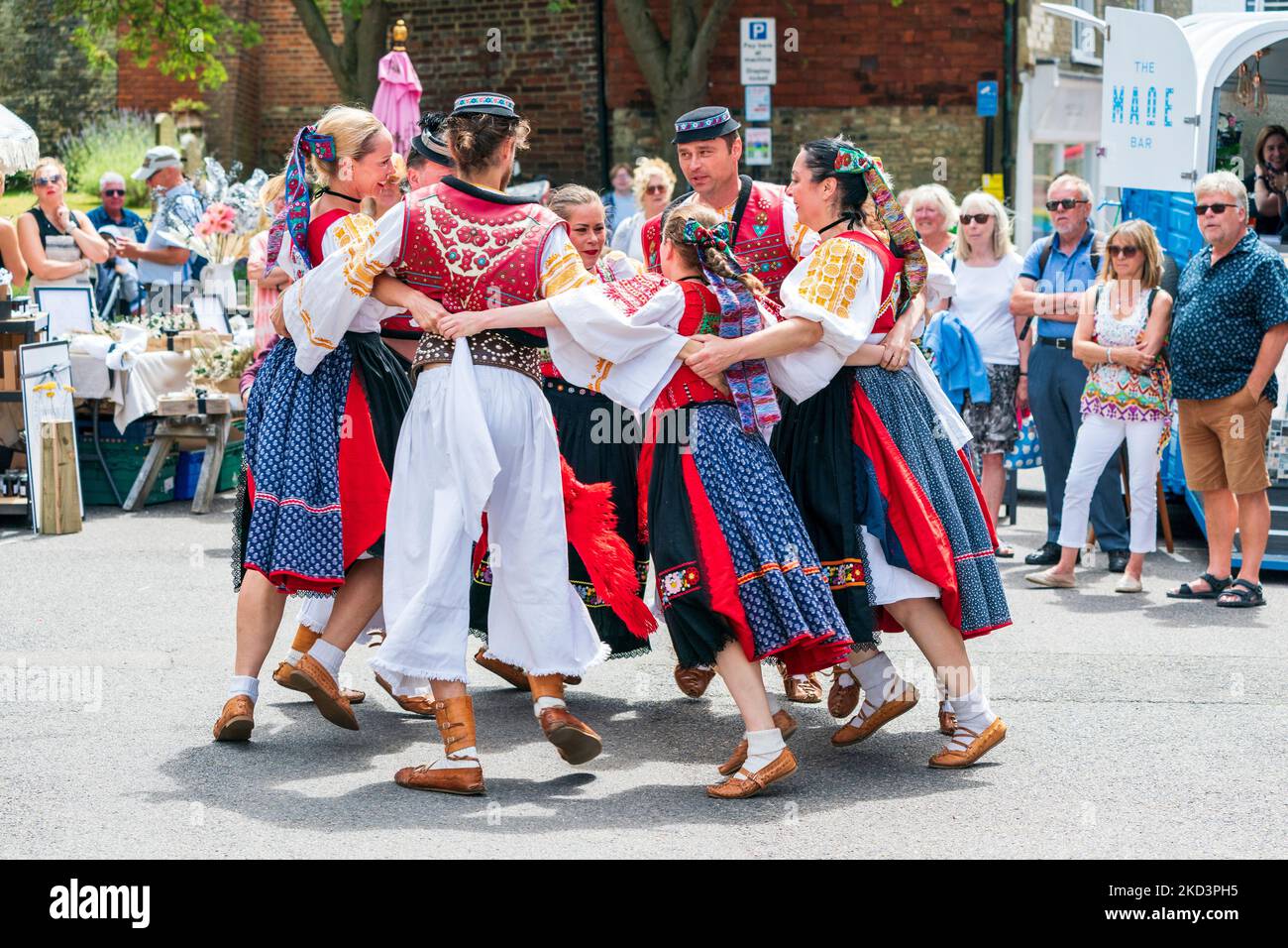 Bulgarian folk dancers in traditional costume dancing on the street at ...