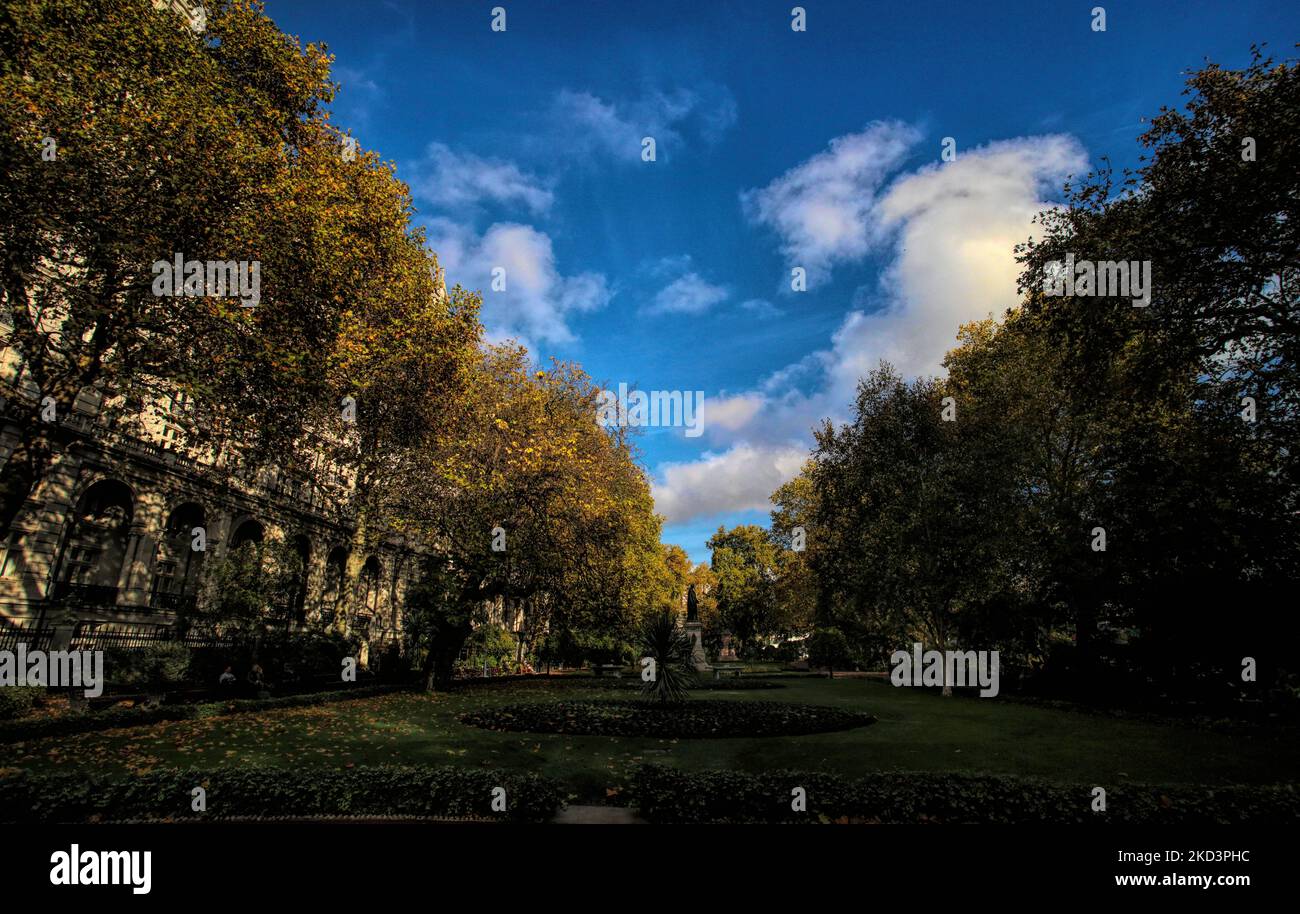 The Whitehall Gardens with the statue of Sir James Outram and a blue ...
