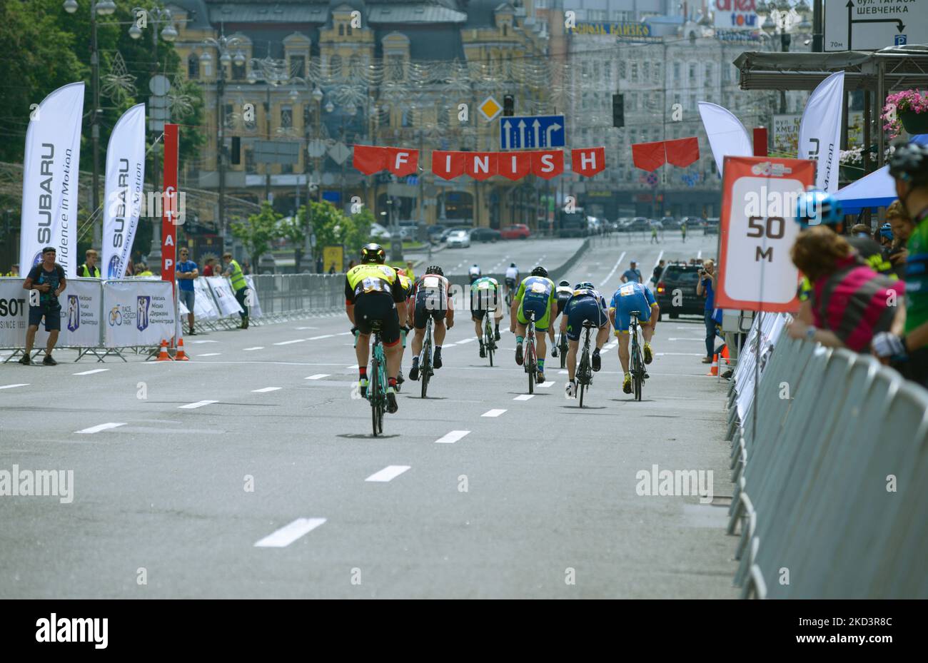 Group of cyclists crossing the finish line. Cycle race among amateurs ...