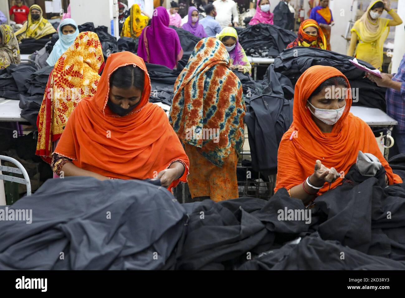 Ready-made garments worker works in a garments factory in Dhaka ...