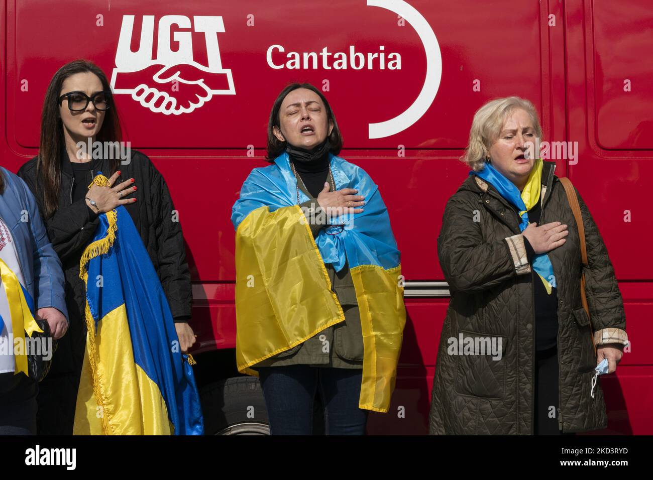 A group of Ukrainian women sing their anthem, during the protest in ...