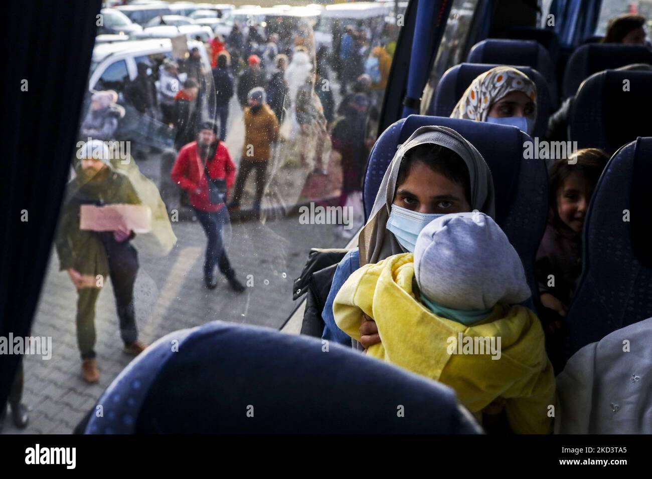 People from the Middle East who fled from Ukraine arrive on a bus to a ...
