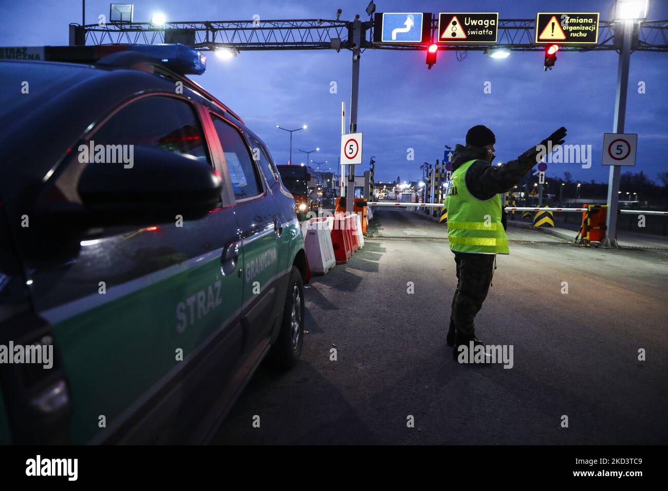 Polish border guard is seen at Ukrainian-Polish border crossing while ...