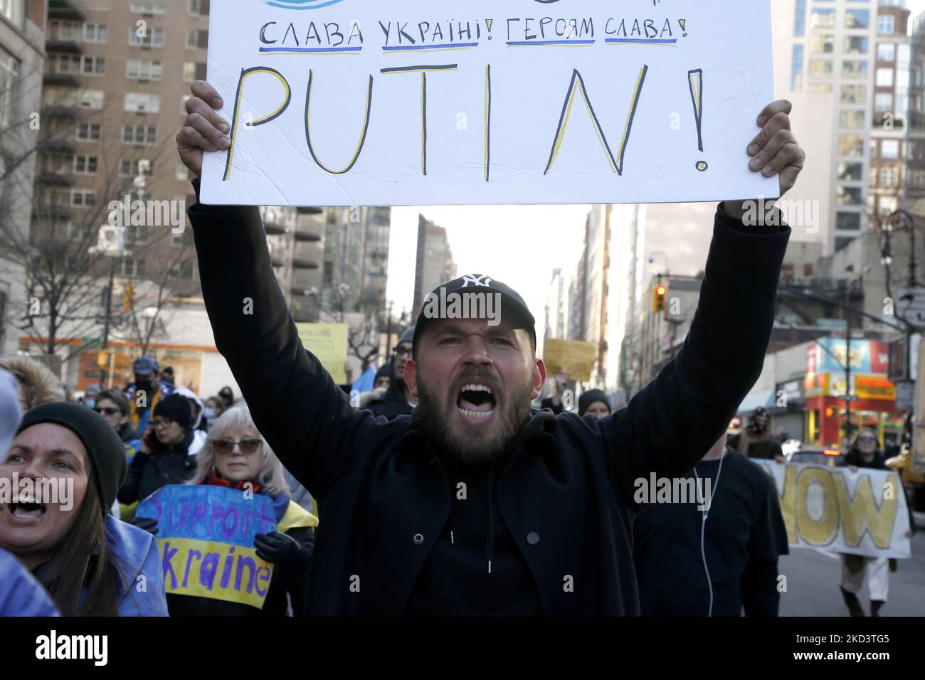 Ukraine supporters march through the Upper East Side chanting slogans ...