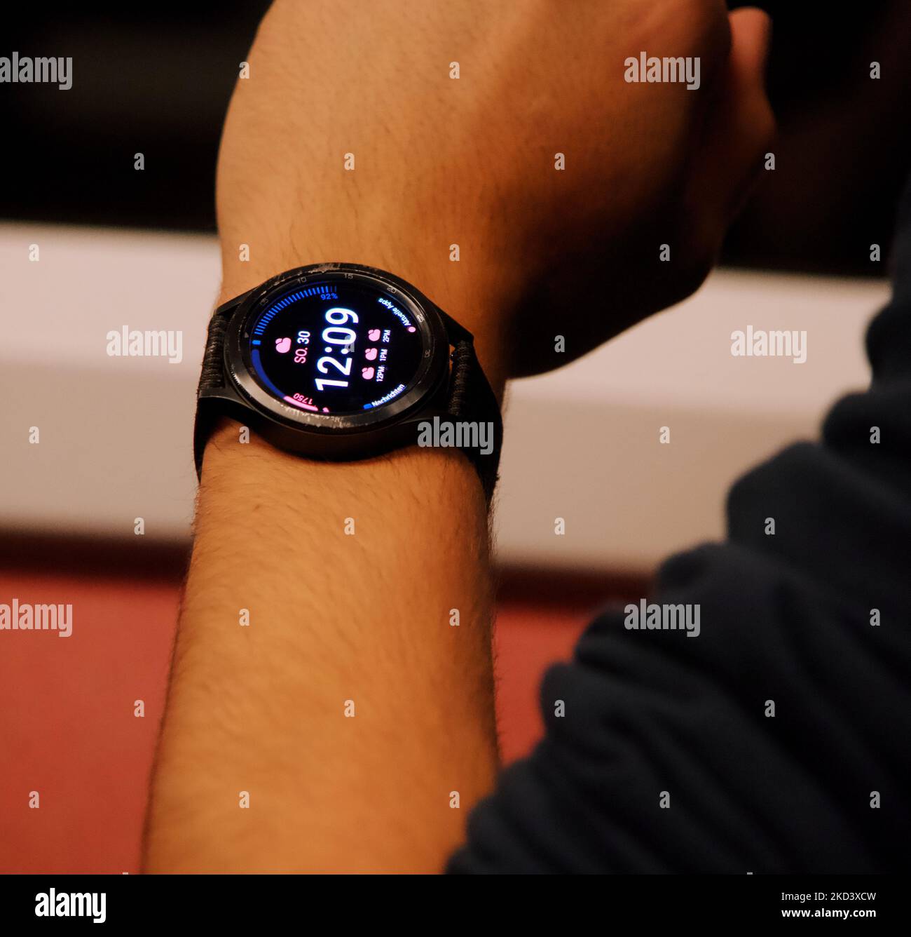An apple watch series 7 product on a man's hand showing time on screen ...