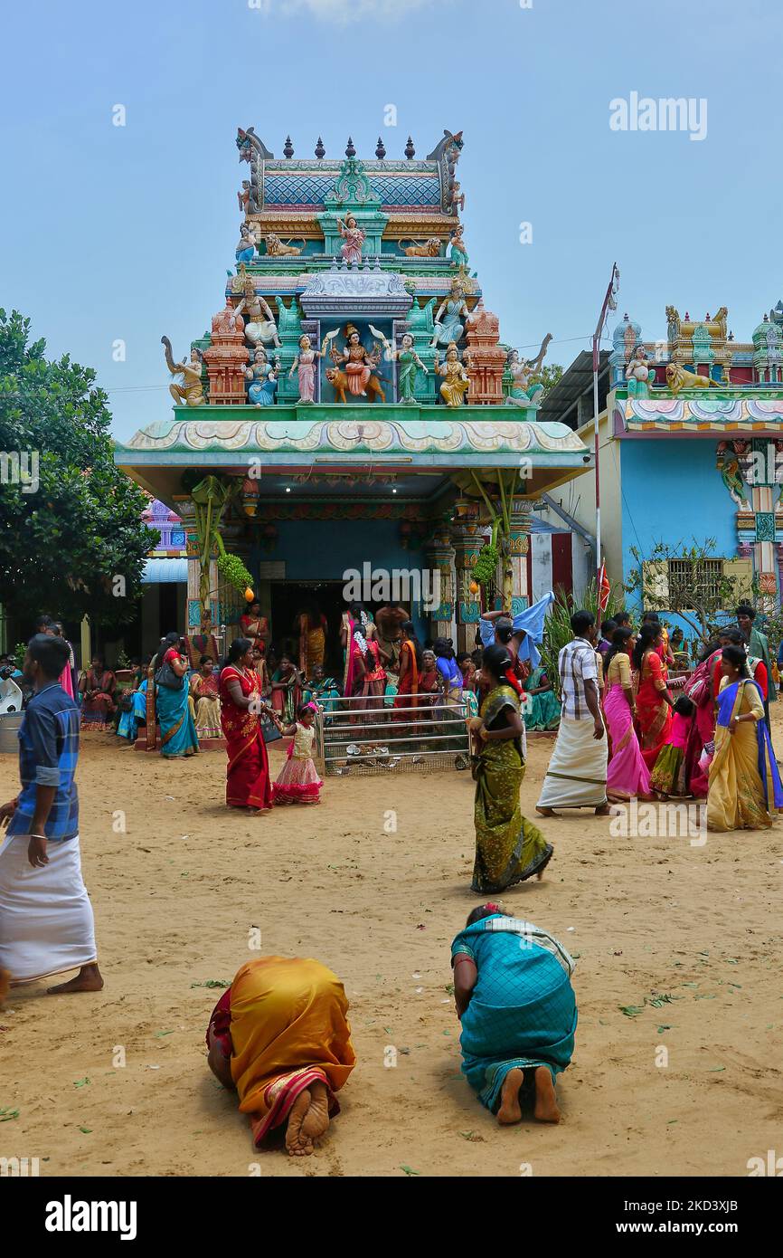 Tamil Hindu women offering prayers at the Tellipalai Amman Temple ...
