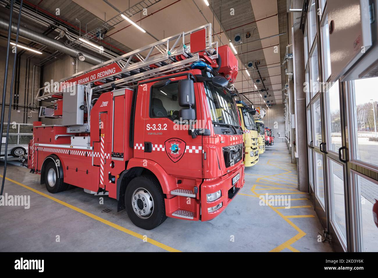 A red ladder truck in the garage of a Norwegian fire station Stock ...
