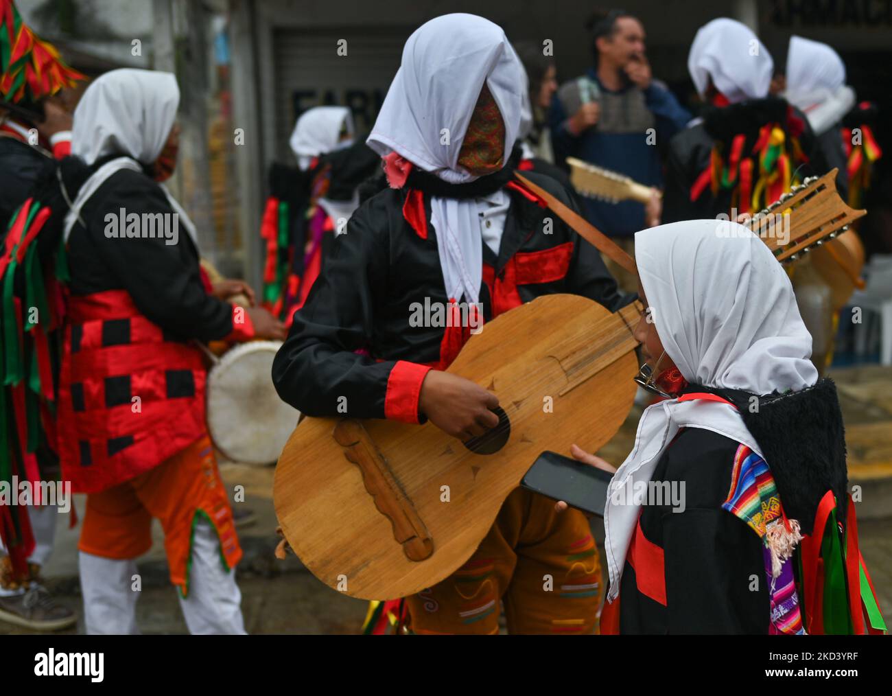 A group of locals wearing traditional dresses heading to the main ...