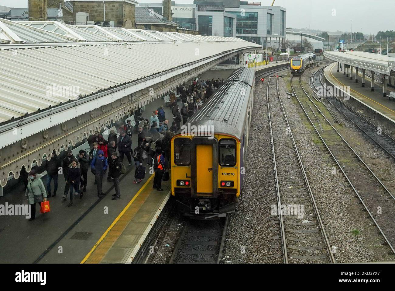 Passengers disembark from a train at Sheffield railway station on 28 ...