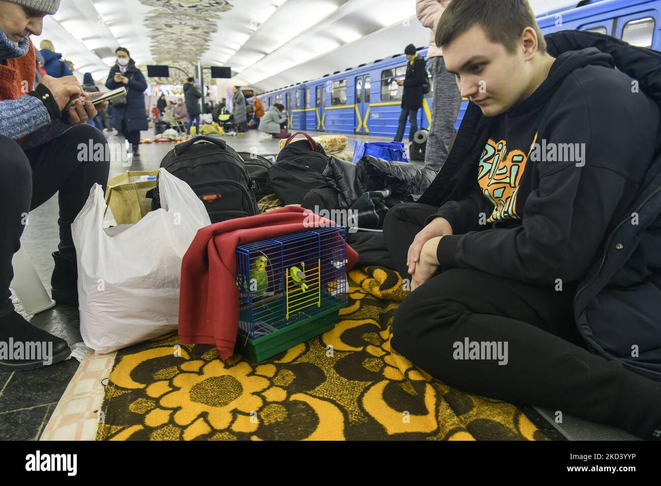 A young man with his parrot on one of the metro stations used as a bomb ...