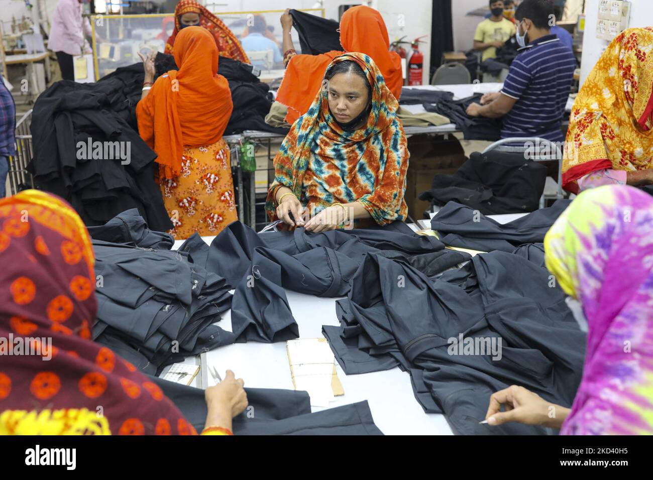 Ready-made garments worker works in a garments factory in Dhaka ...
