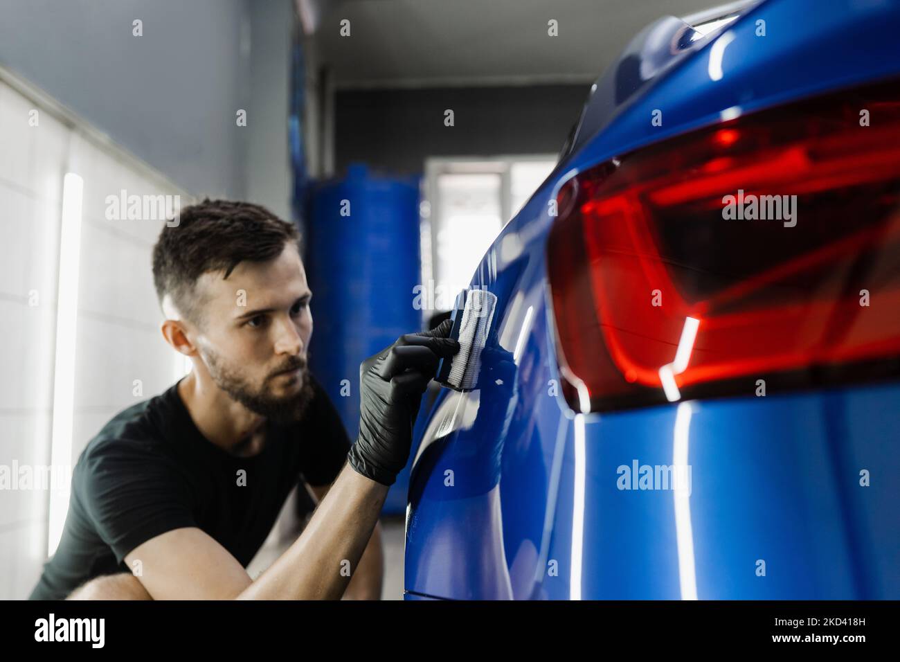 Hand applying of nano ceramic protective coat to protect car from ...