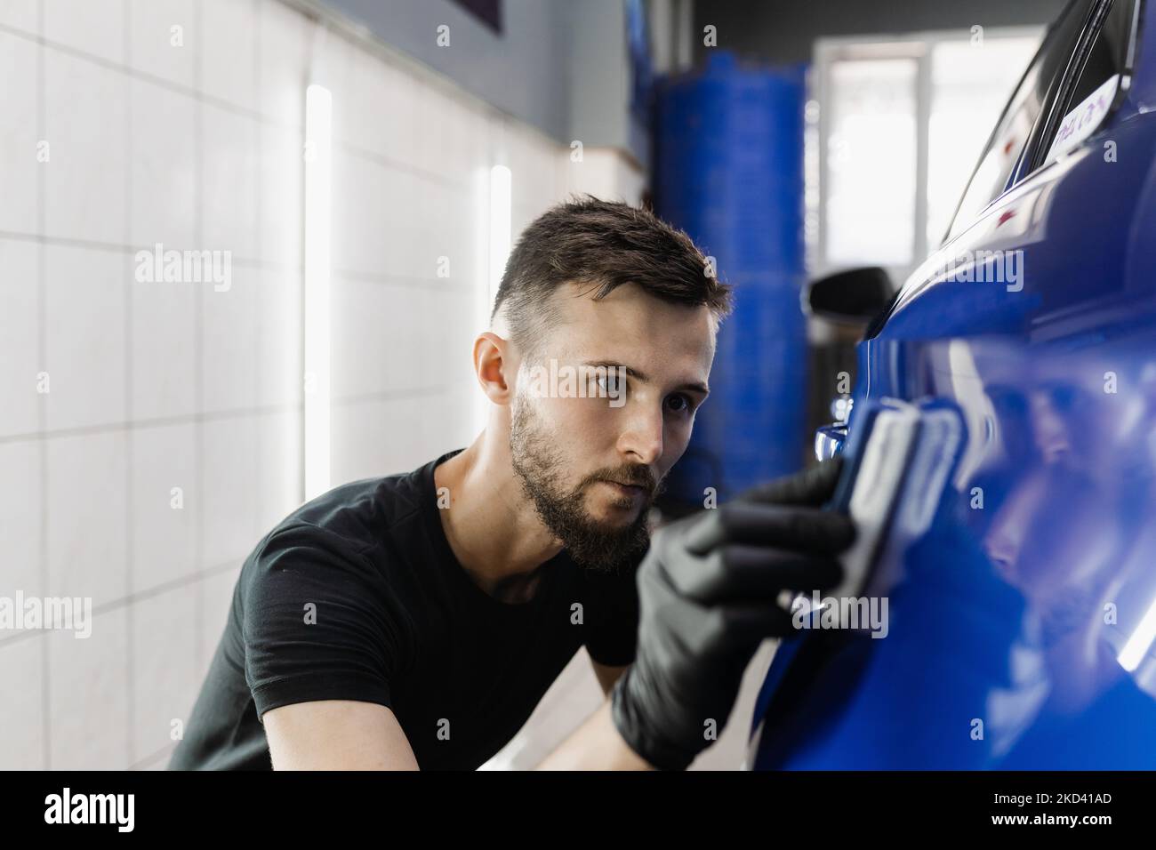 Hand applying of nano ceramic protective coat to protect car from ...