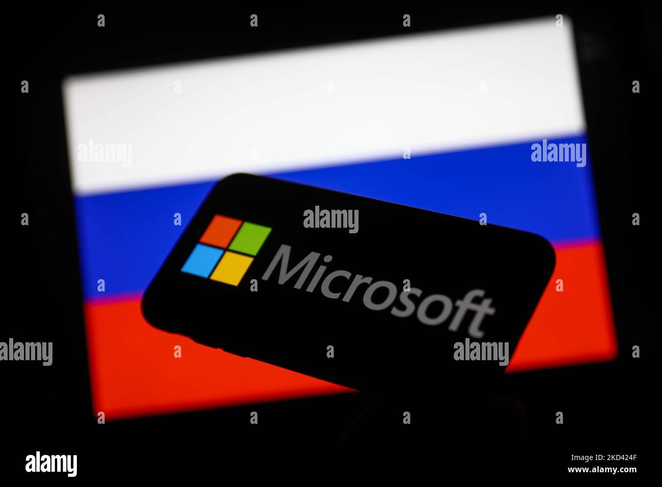 Microsoft logo displayed on a phone screen and Russian flag displayed ...