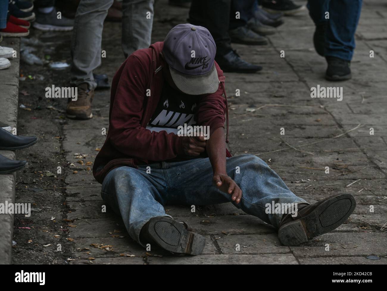 An injured man, a scene of bull running through the streets of San Juan ...