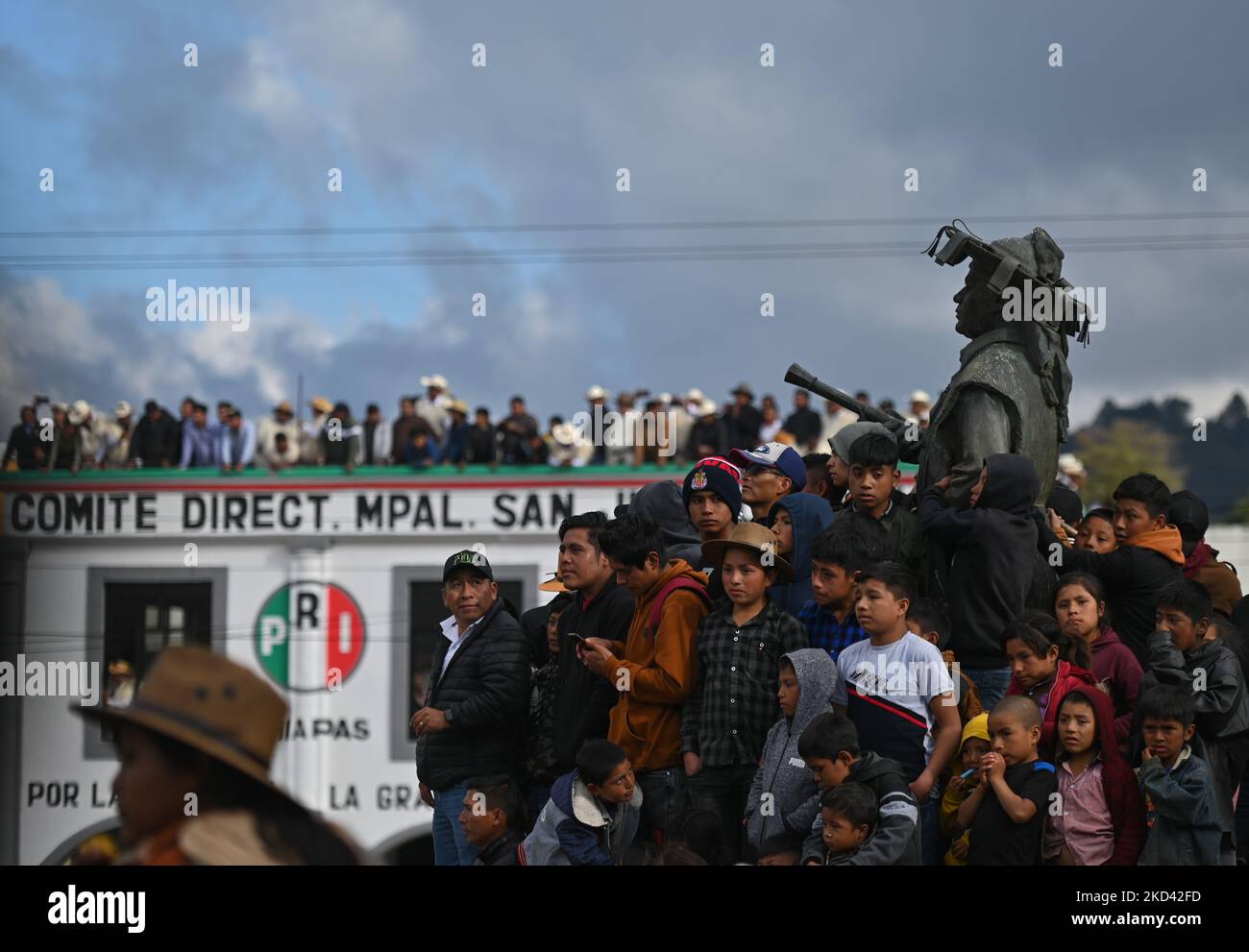 Locals watch bull running through the streets of San Juan Chamula on ...