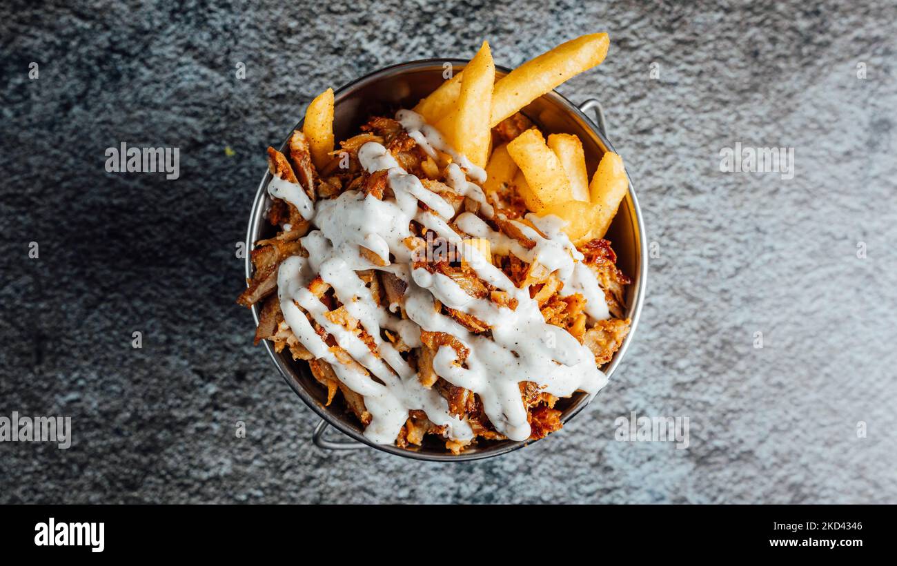 A closeup shot of French fries with chicken and mayo Stock Photo - Alamy