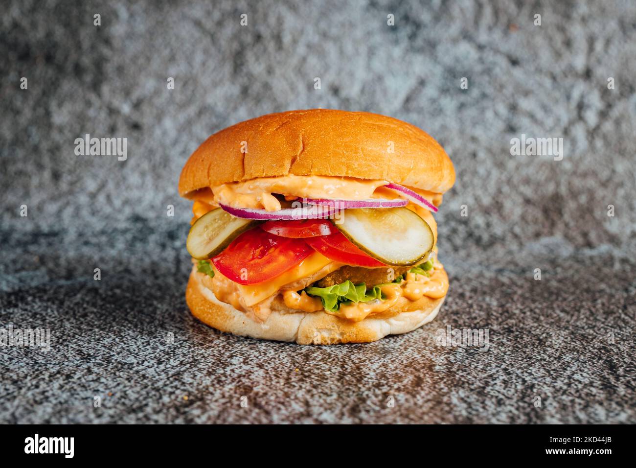 A closeup shot of a delicious burger on a grunge surface Stock Photo ...