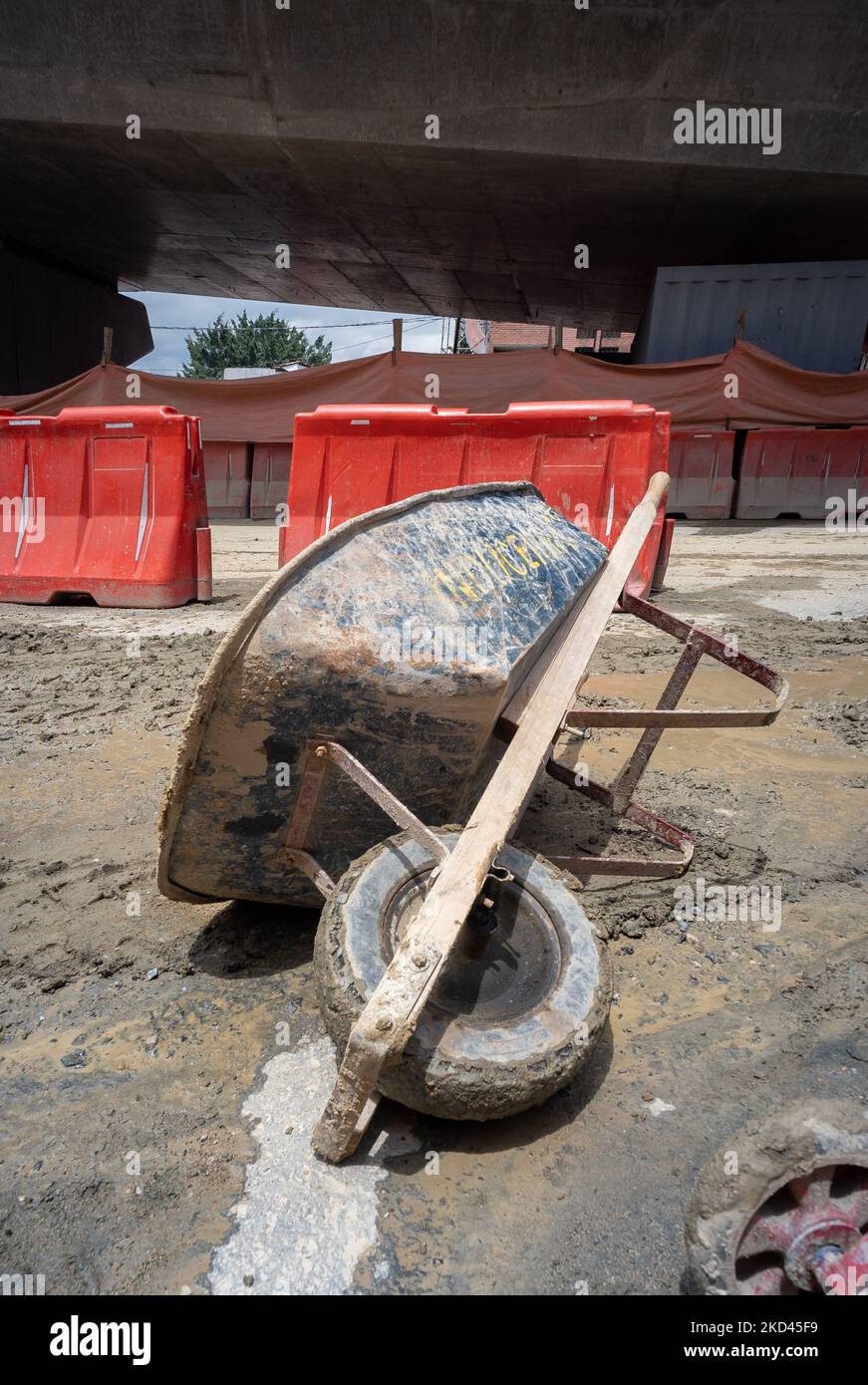 Wheelbarrow Loaded with Construction Materials, on a Dirty Road Stock ...