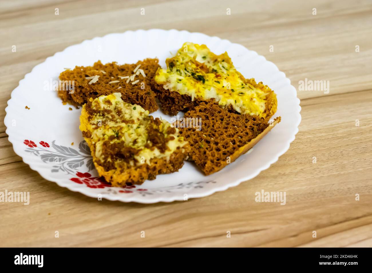 indian traditional sweet ghevar served in white plate from different ...