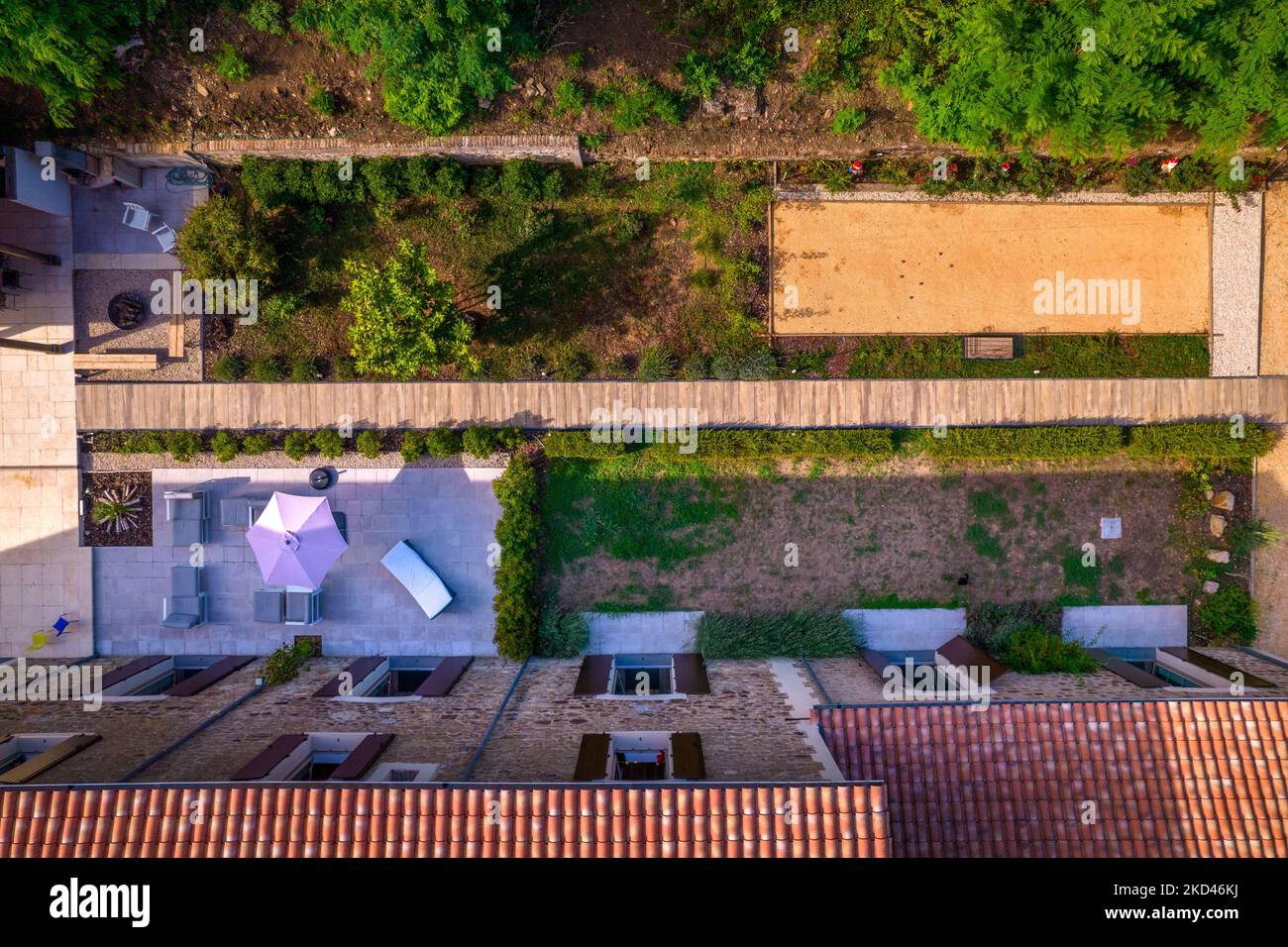 An aerial view of a private exterior, terrace and garden with trees ...