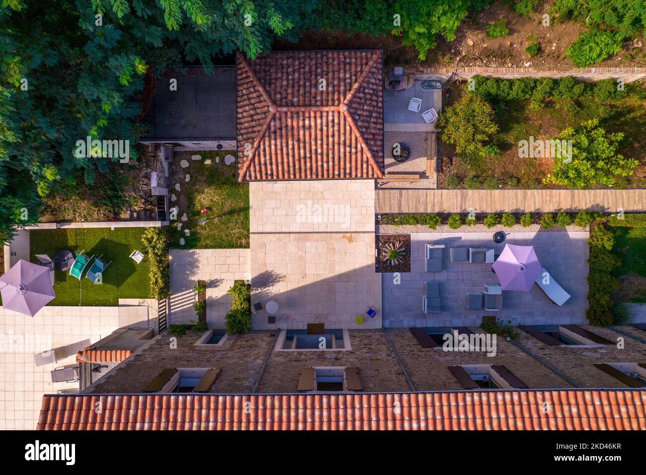 An aerial view of a private exterior, terrace, garden with patio, trees ...