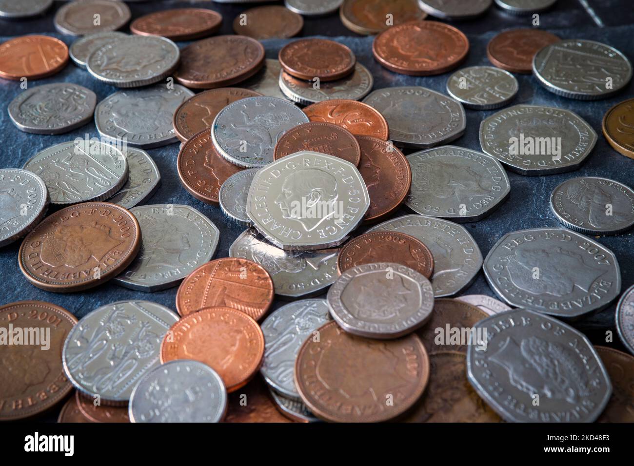 Loose change including the new Fifty pence piece featuring King Charles ...