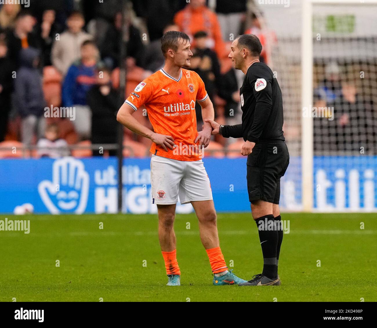 Referee Tim Robinson speaks with Callum Connolly #2 of Blackpool during ...