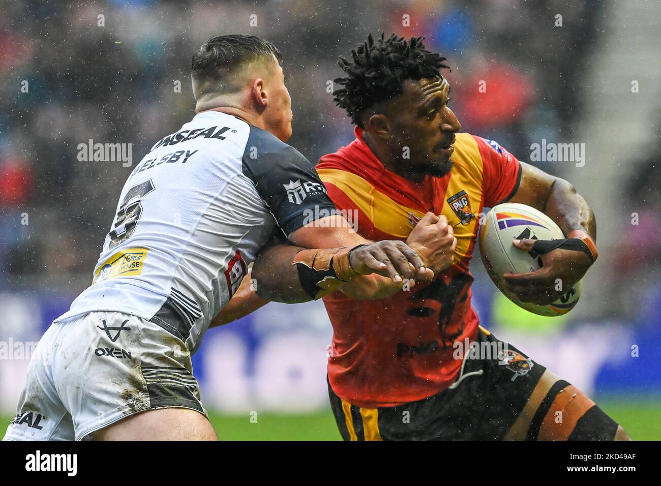 Nixon Putt of Papua New Guinea is tackled by Jack Welsby of England ...